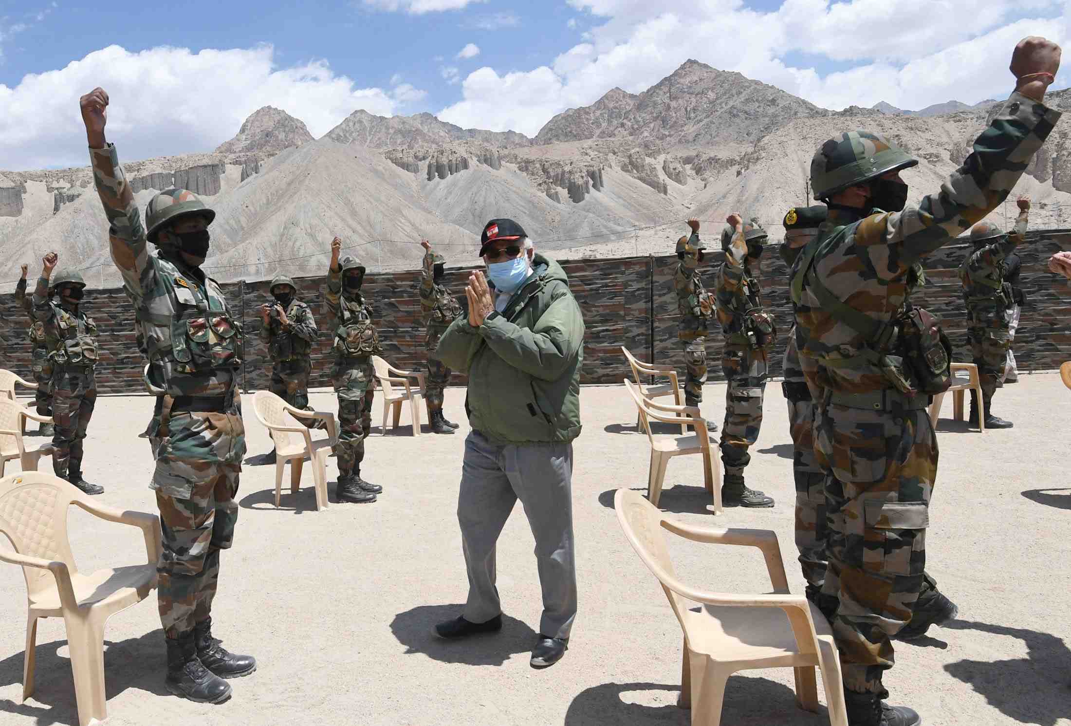 India's PM Modi gestures as he interacts with army soldiers during his ...