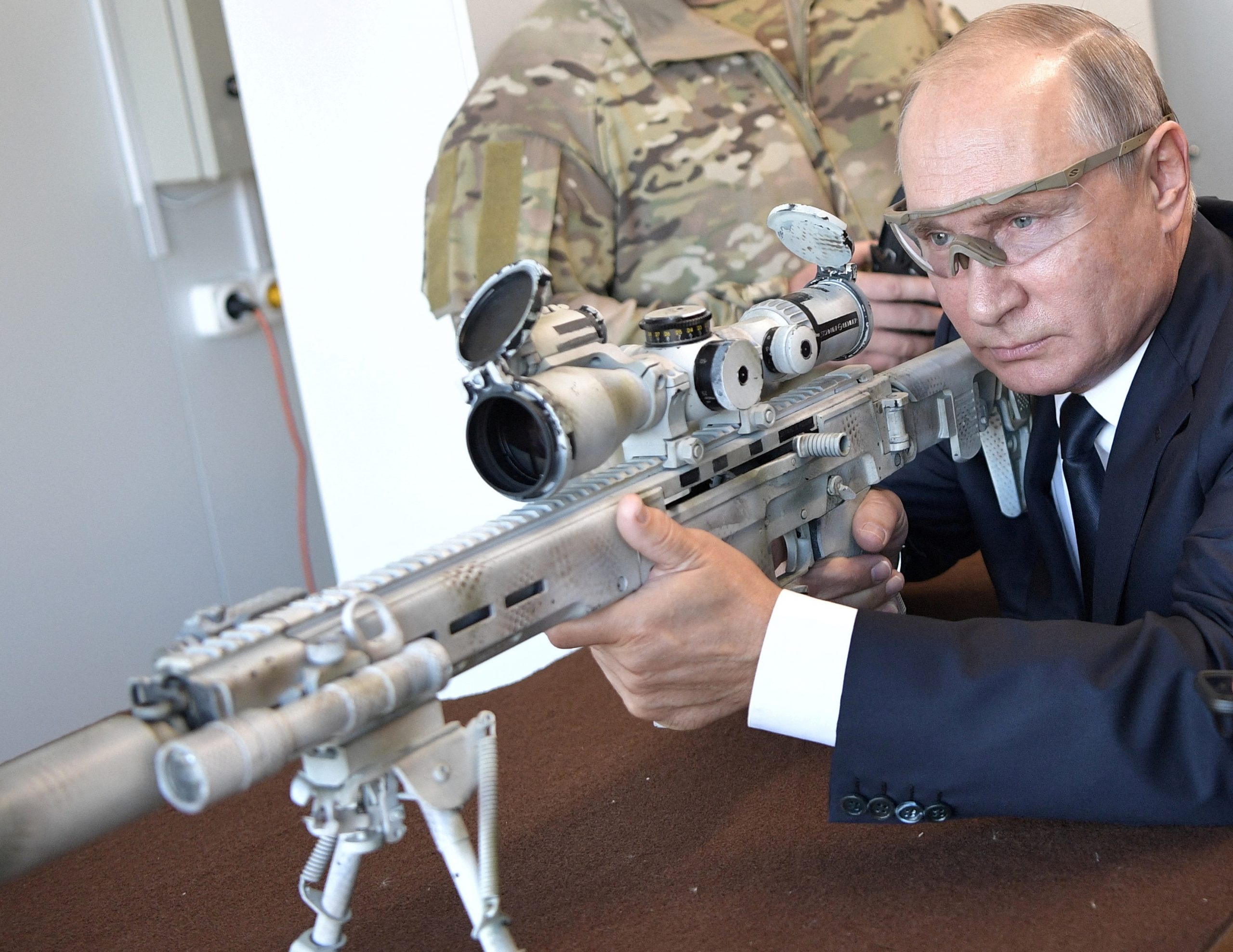 FILE PHOTO: Russian President Putin aims a Chukavin sniper rifle SVCh ...